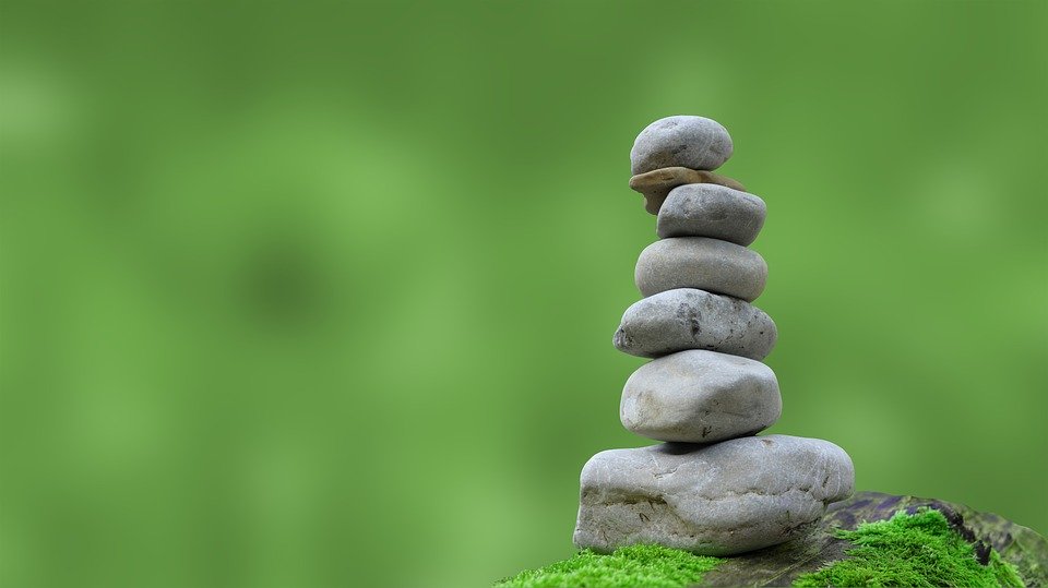 mindful stones green background | Ellen Rogin